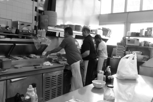 Working the Grill by Christopher Charron
